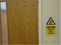 Caution Uneven floor surface symbol and text safety sign. | WS3790 ...